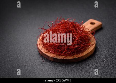 Red thin hot chili threads on a dark background. For decorating Asian ...