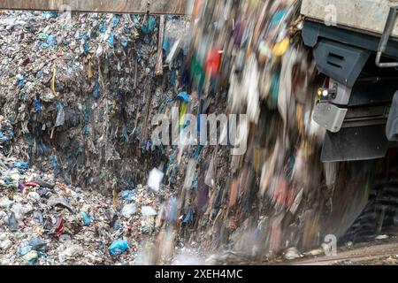 Garbage is delivered and dumped into the garbage bunker Stock Photo - Alamy