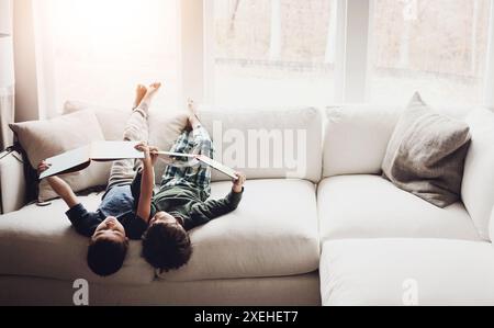 Upside down kids, fun or reading books in education, learning or relax ...