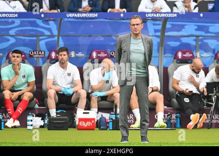 Austria head coach Ralf Rangnick smiles as he listens to a question ...