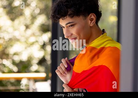 Young woman at home holding flag of Germany cover mouth with hand ...