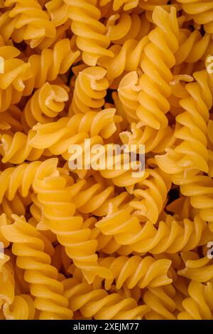Raw fusilli pasta from whole grain wheat varieties Stock Photo - Alamy