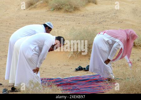 Bedouins During The Prayer. Arabian Desert. Saudi Arabia Stock Photo ...