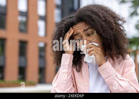A Diverse Female Student With Headache Stock Photo - Alamy