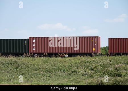 UES shipping container on a freightliner train, Warwickshire, UK Stock ...