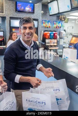 Prime Minister Rishi Sunak buys traditional fish and chips for the ...