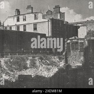 City of London Blitz bomb damage. A ground level view with the spire of ...