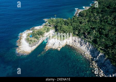 Aerial view of Patokan Beach (Jiko) with palm trees and cliffs in North ...