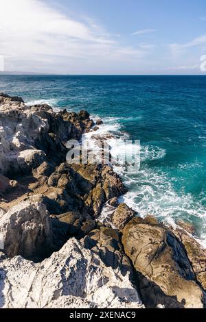 Rugged coastline at Patokan Beach (Jiko) with a view out to the ocean ...