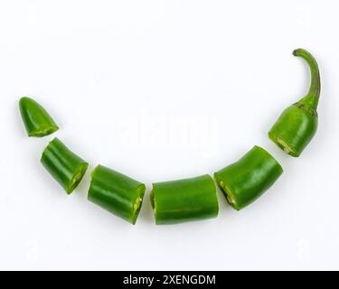 Close-up of sliced green jalapeno peppers in white rectangular dish ...