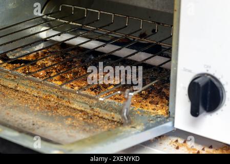Dirty and uncleaned oven toaster Stock Photo - Alamy