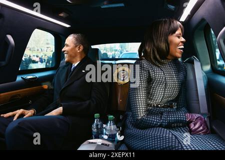 President Barack Obama and First Lady Michelle Obama wave during the ...