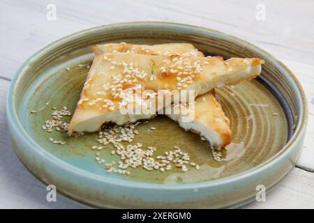 Greek fried feta with honey and sesame seeds Stock Photo - Alamy