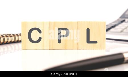 Wooden cubes with the the abbreviation CPC cost per click. Business ...