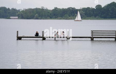 Prien, Germany. 30th June, 2024. Excursionists take a boat trip on Lake ...