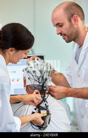 Investigator and patient with assistive robot for upper limb ...