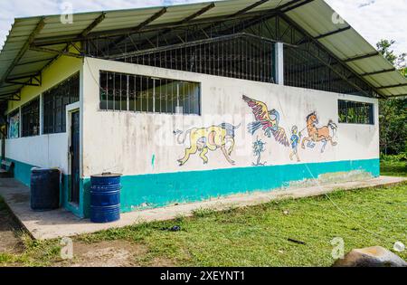 Animal paintings on teh wall of a building at the Pilchi Community on ...
