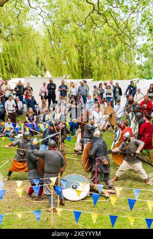 Mock battle with with two groups knights fighting each other in roped ...
