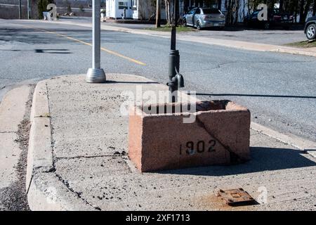 Vintage communal water pump and trough on Portage Street in downtown St ...
