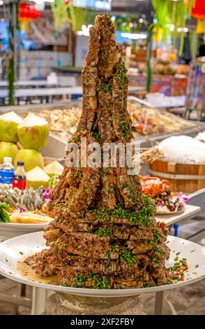 Famous Thai food dish called, “Leng Saap” stacked pork topped with ...