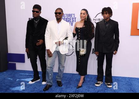 Usher Raymond V, Usher, Jennifer Goicoechea, and Nayvid Ely attend the ...