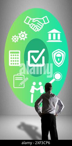 Businessman watching validation concept on a laptop Stock Photo - Alamy