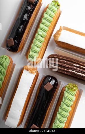 Eclairs Selection, Different Delicious Eclairs on White Background ...