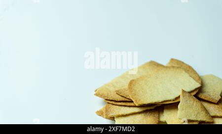 Broken baked chips crisps isolated on white background Stock Photo - Alamy