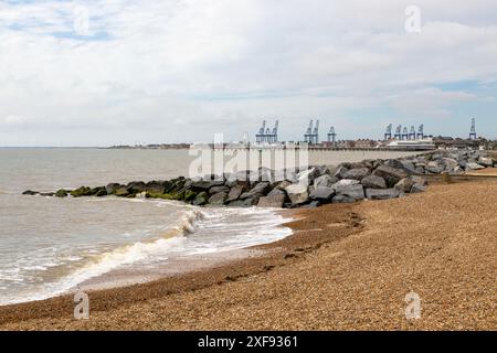 Rock armour groynes on beach managing longshore drift, Felixstowe ...
