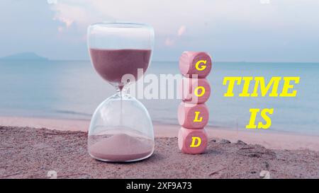 time concept with hourglass and sunrise at a beach. Time is gold quote ...
