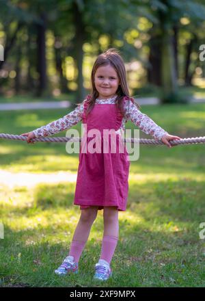Primary school girl 6 to 7 year old using computer Stock Photo - Alamy