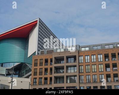 Red roof brick modern building in the city Stock Photo - Alamy