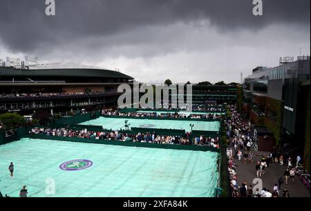 Storm clouds over courts 14-17 as rain stops play on day two of the ...