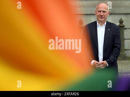A Pride flag is raised to mark pride season on Parliament Hill in ...