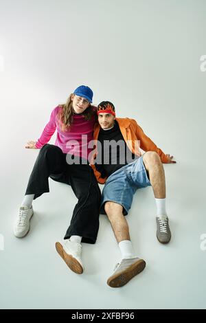 Two men sitting intertwined on top of each other Stock Photo - Alamy