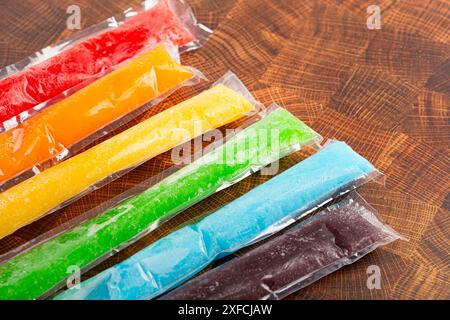 Rainbow Frozen Ice Popsicle on a Kitchen Counter Stock Photo - Alamy