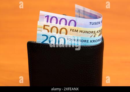 Norwegian crown in the black wallet Stock Photo - Alamy