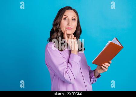 Photo of doubtful pretty lady dressed puple blouse looking empty space ...