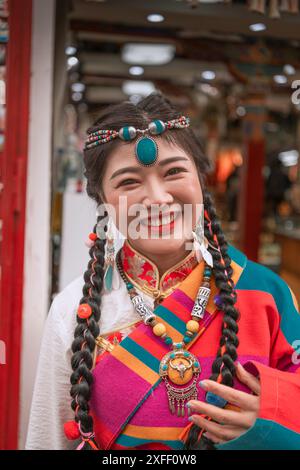 Lhasa, Tibet, July 3, 2022: Lady posing at ancient temple door in a ...