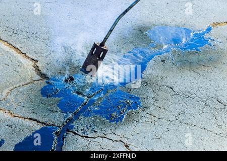 Bitumen emulsion joint seal restorer is used to repair cracks in ...