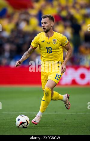Munich, Germany. 2 July 2024. Denis Dragus of Romania in action during ...