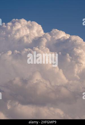 Natural background. Big and fluffy cumulonimbus cloud in the blue sky ...
