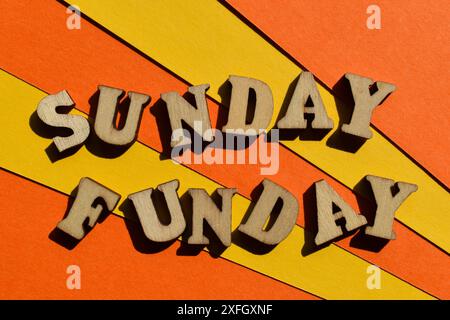 Sunday Funday, phrase in wooden alphabet letters isolated on background ...