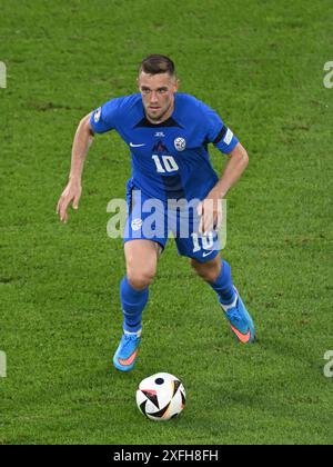 COLOGNE, GERMANY - JUNE 25: Timi Elsnik of Slovenia dribbles during the ...