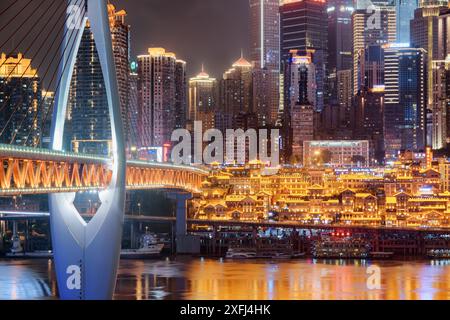 The night view of Qiansimen bridge and the skyline in Chongqing, China ...
