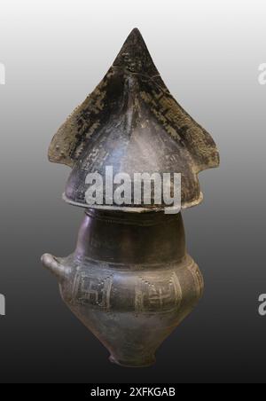 A cinerary urn with a helmet lid, Villanova, 9th/8th century B.C. Dark ...