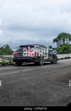Black Audi RS6 rear view in empty street, cloudy day, Luxury family car ...