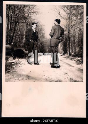 Vintage image of two men modelling suits in a snowing forest (1960s ...
