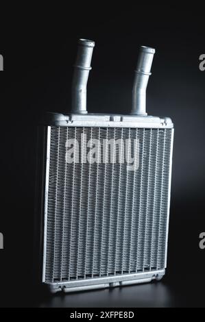 Aluminum new heater core. Car parts on a black background Stock Photo ...