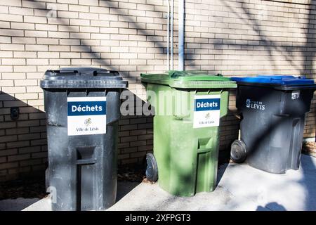 Wheelie garbage, recycling and organics bins at apartments on chem. du ...